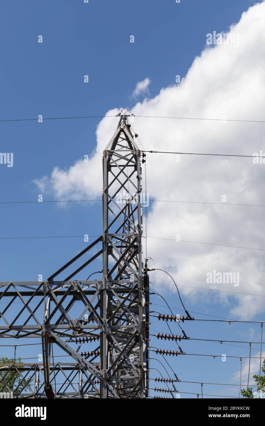 Tall metal trusses carrying electrical power lines and strain ...