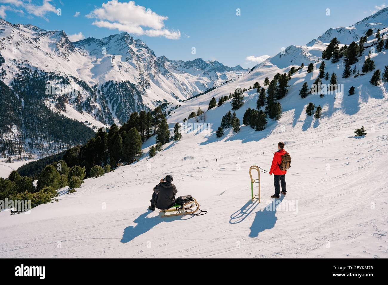 Speeding downhill on wooden sled. Happy influencer having fun with wood ...