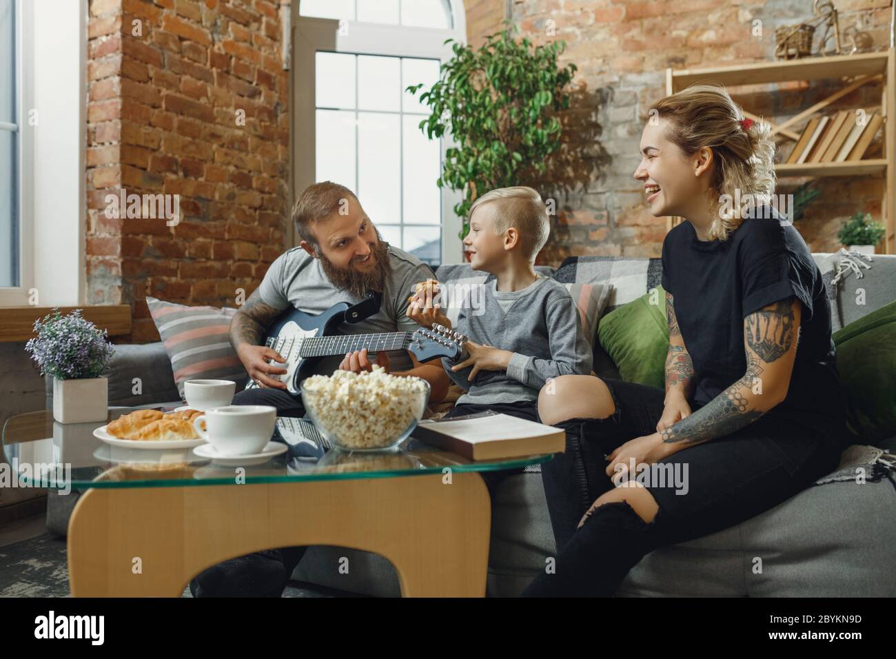 Happy family at home spending time together. Having fun, look cheerful ...