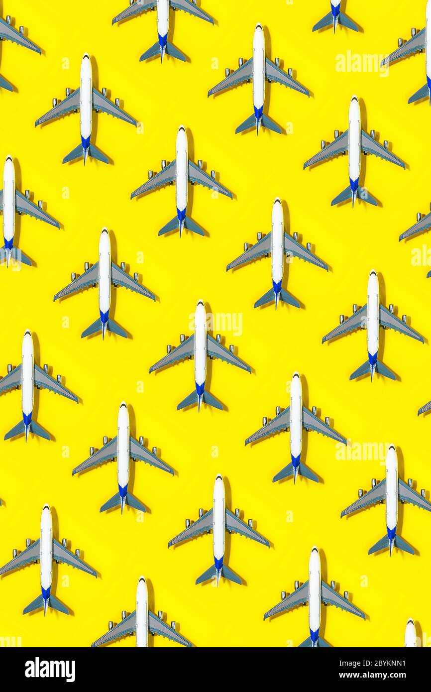 Pattern made of model airplane on yellow background. Travel vacation ...