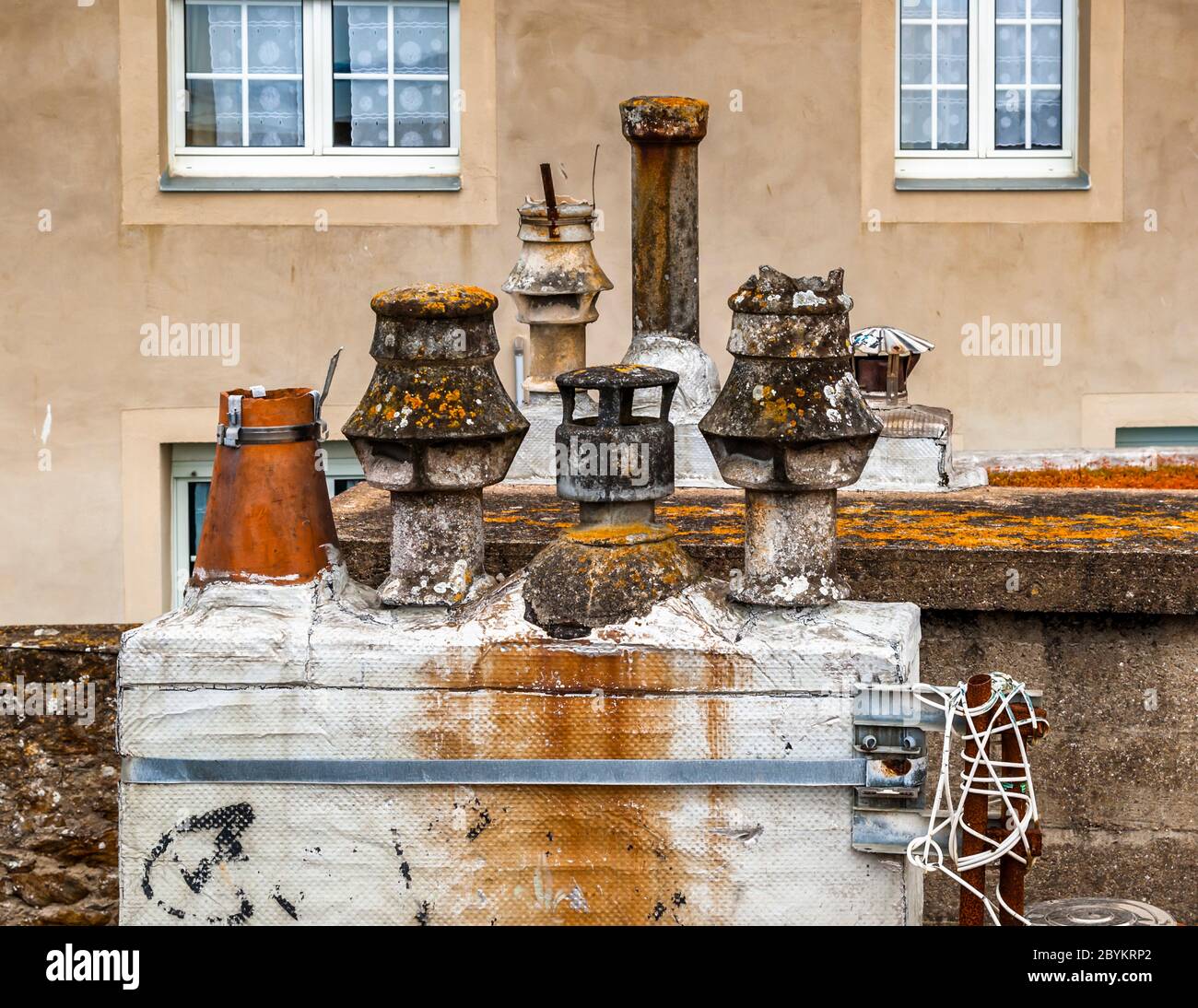 Different chimney tops on a single chimney in Saint-Malo, France Stock ...