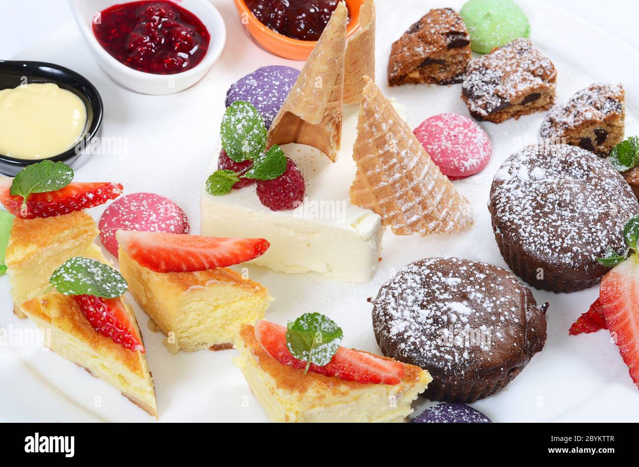 Plate of different desserts isolated Stock Photo - Alamy