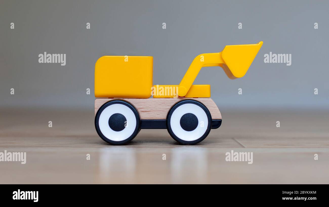 Simple wheel dozer toy Stock Photo - Alamy
