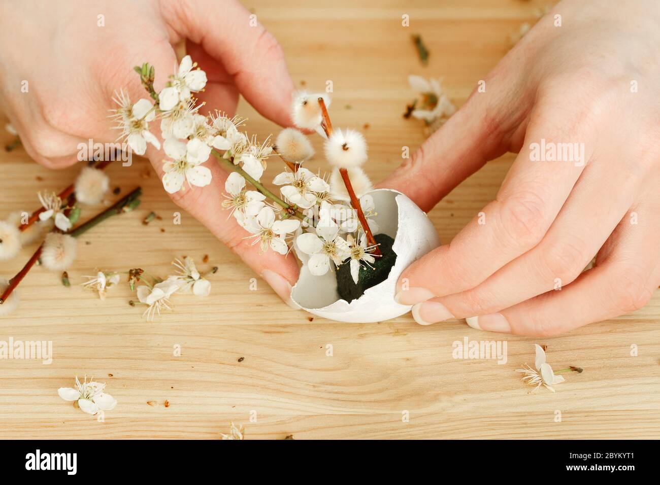 Florist at work: woman shows how to make simple decoration for Easter ...