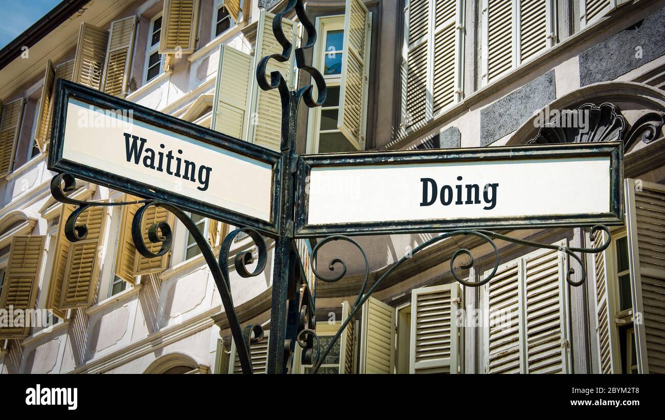 Street Sign the Direction Way to Doing versus Waiting Stock Photo - Alamy