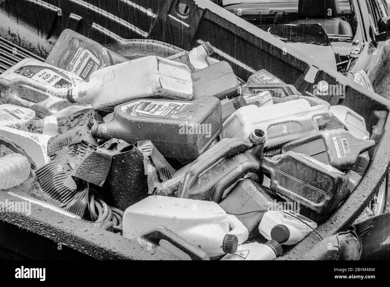 stack of the empty oil bottles and raindrop Stock Photo - Alamy
