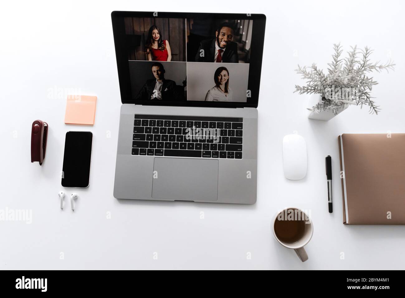 Modern white office desk table with laptop, smartphone and other ...