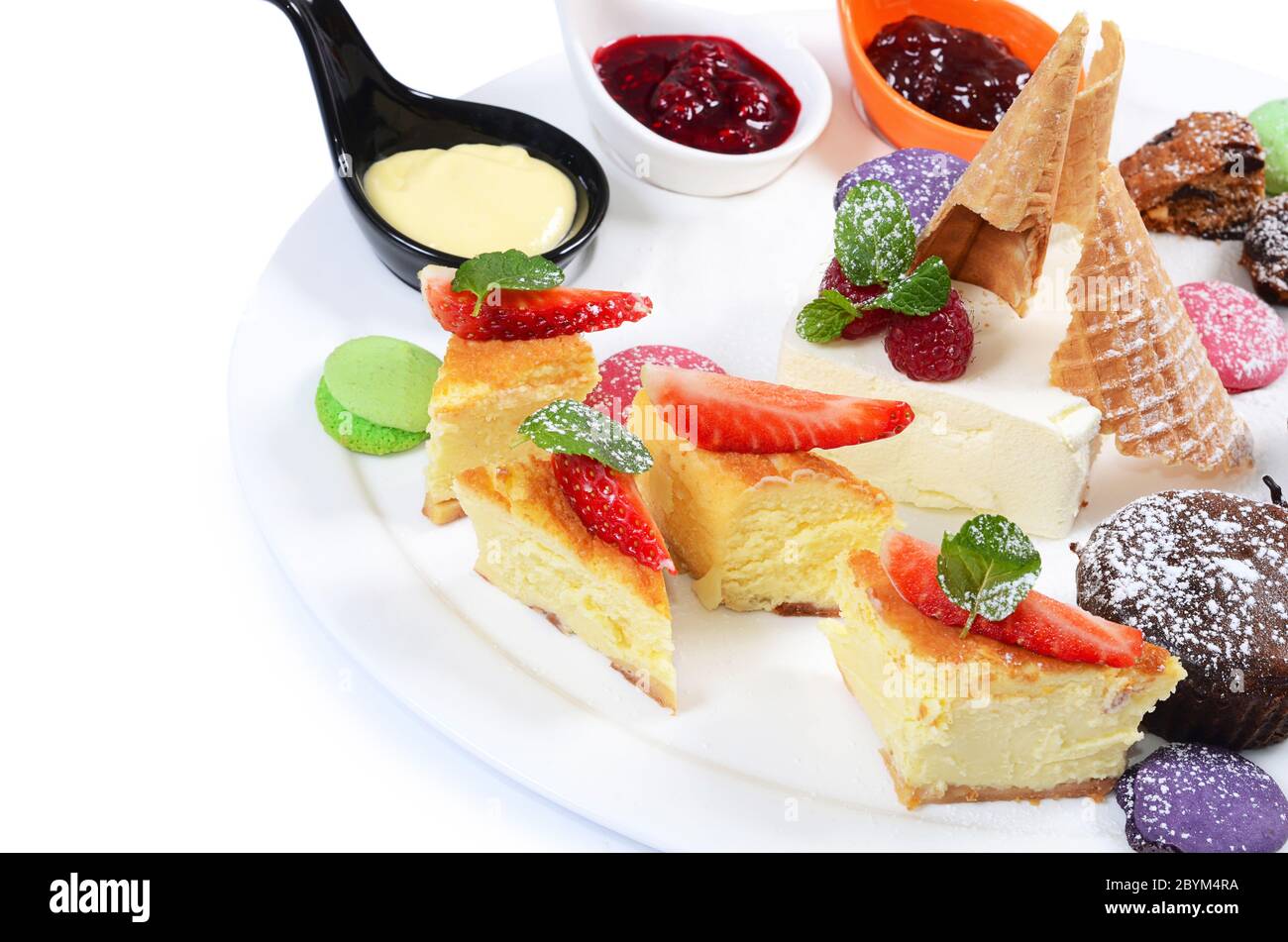 Plate of different desserts isolated Stock Photo - Alamy