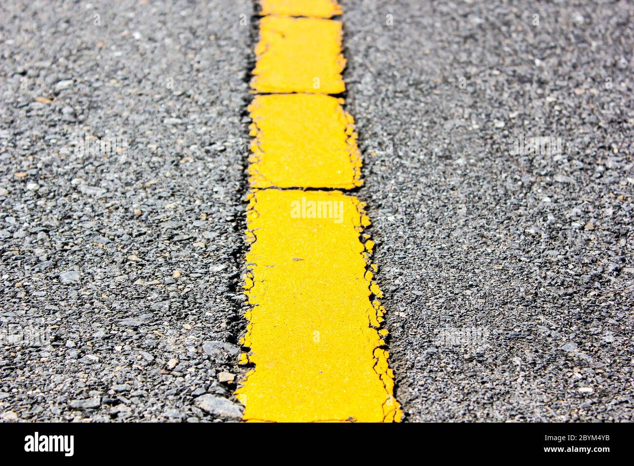 surface of asphalt road yellow line close up background Stock Photo - Alamy