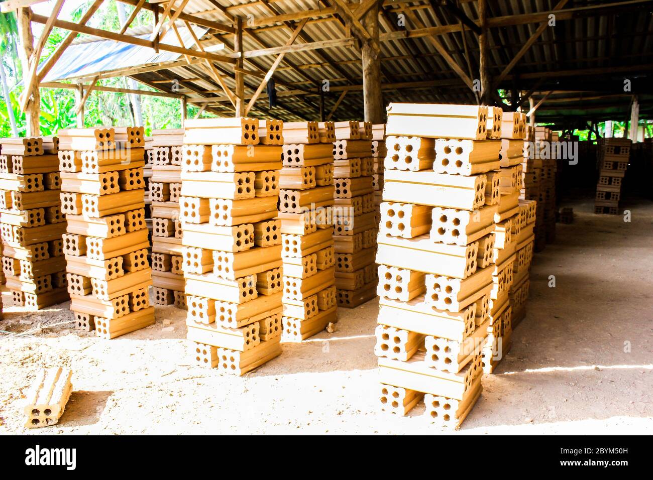 brick kiln. collection set of red bricks stack in oven factory before ...
