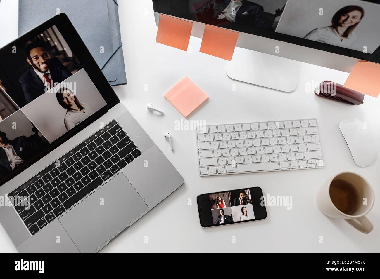 Modern white office desk table with laptop, smartphone and other ...