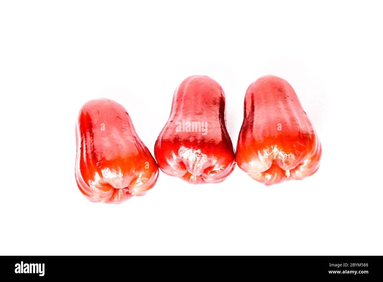 red fruit, rose apples or chompoo isolated in plate on white background ...