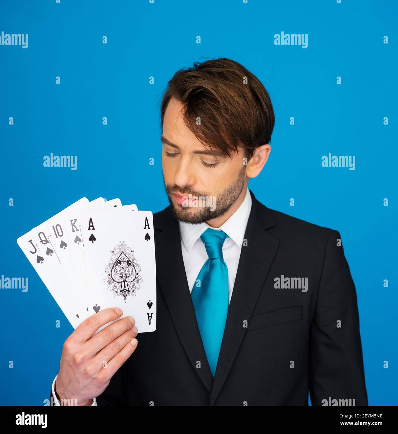 young business man showing playing cards Stock Photo - Alamy