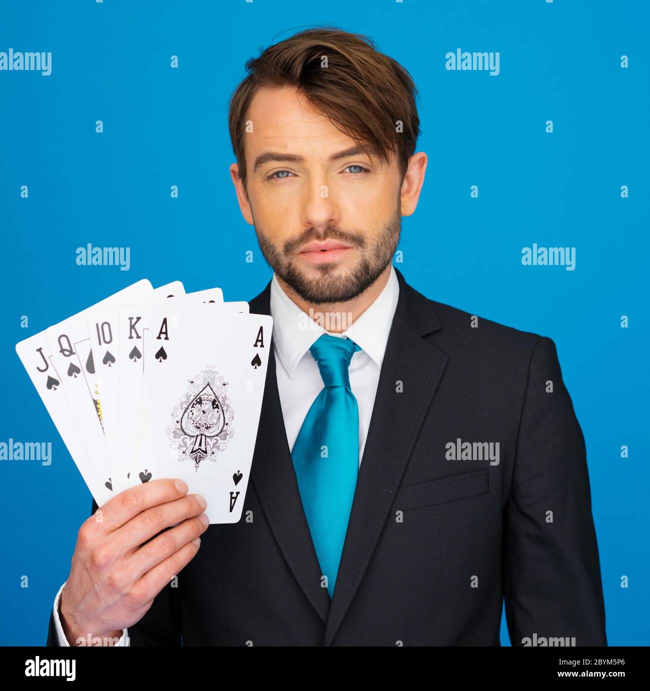 Young man showing cards hi-res stock photography and images - Alamy