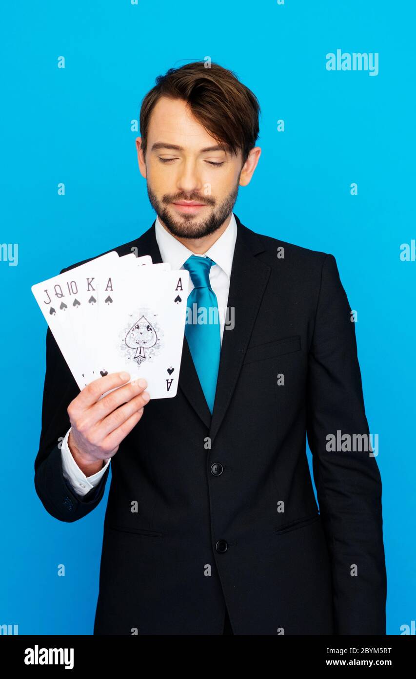 young business man showing playing cards Stock Photo - Alamy