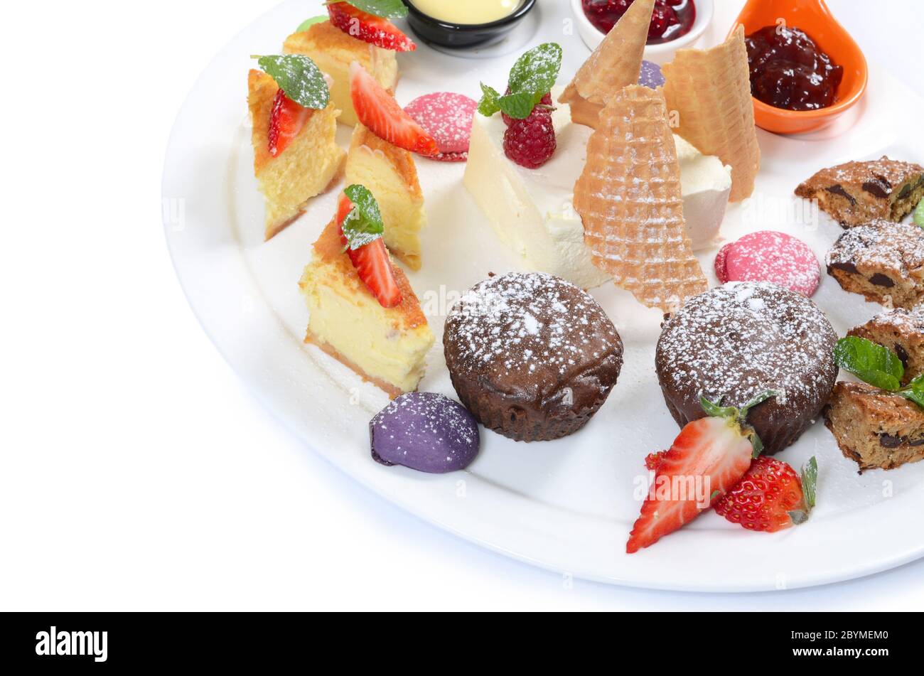 Plate of different desserts isolated Stock Photo - Alamy