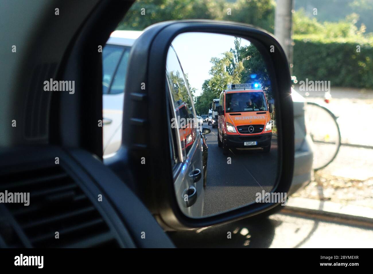 Ambulance in rear view mirror hi-res stock photography and images - Alamy