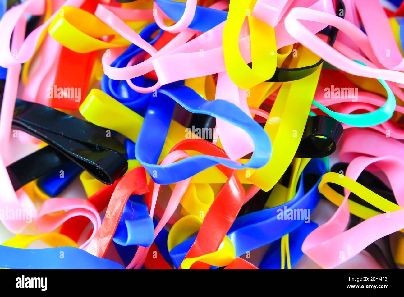 colorful elastic rubber bands on white texture background Stock Photo ...