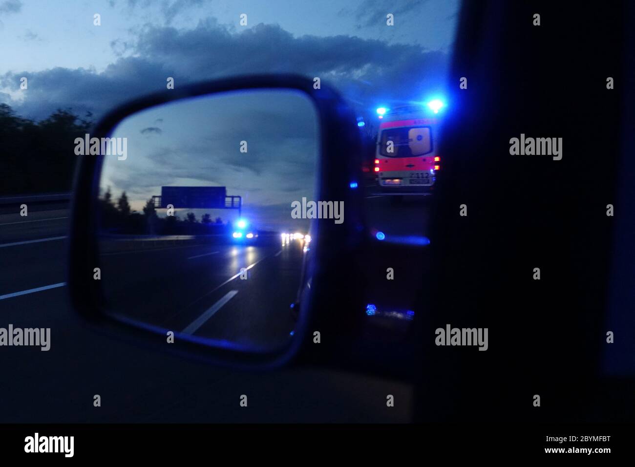 Ambulance in rear view mirror hi-res stock photography and images - Alamy