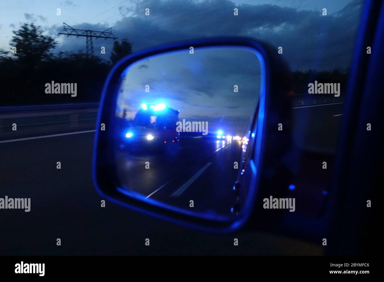 Ambulance in rear view mirror hi-res stock photography and images - Alamy