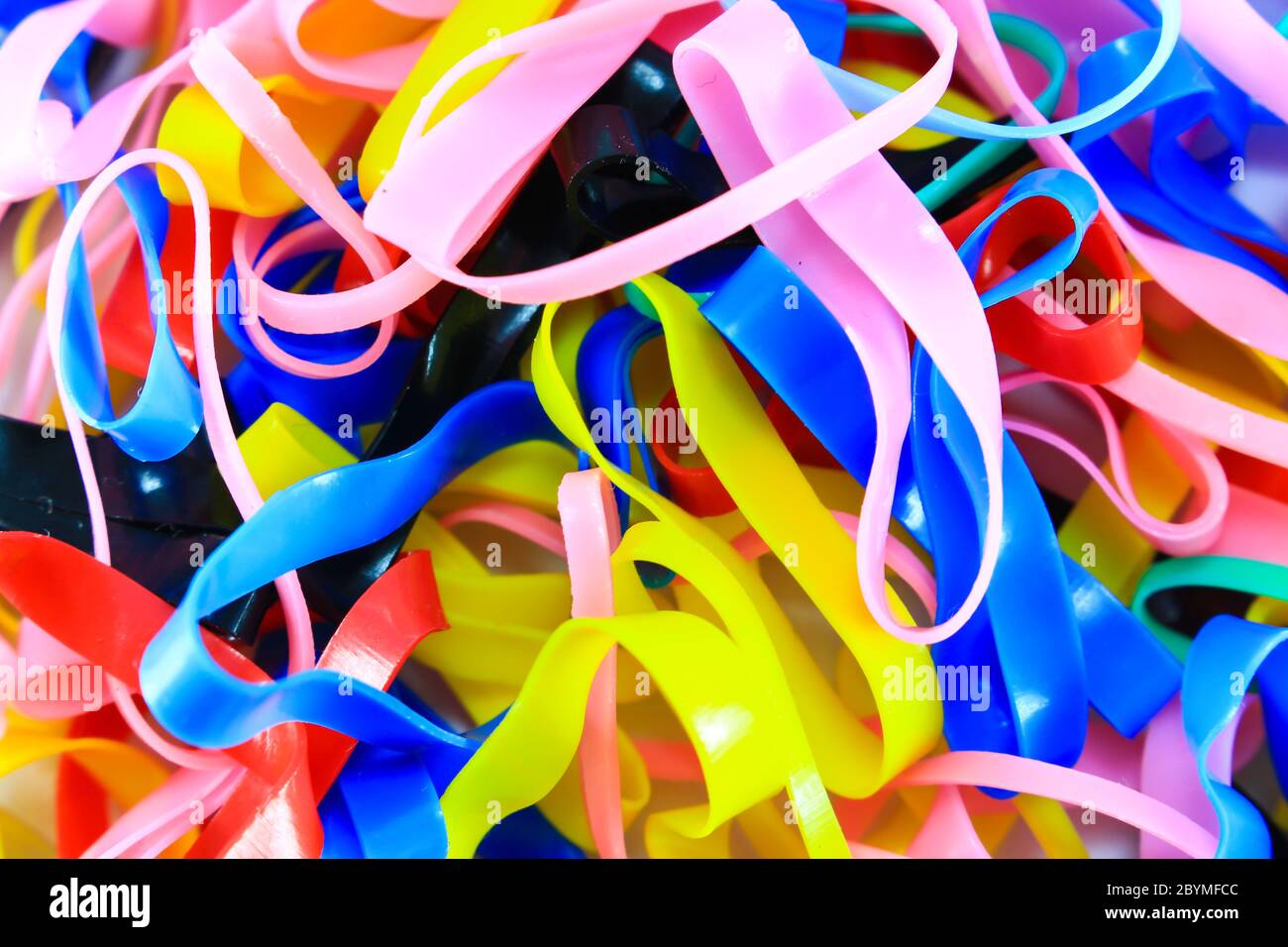 colorful elastic rubber bands on white texture background Stock Photo ...