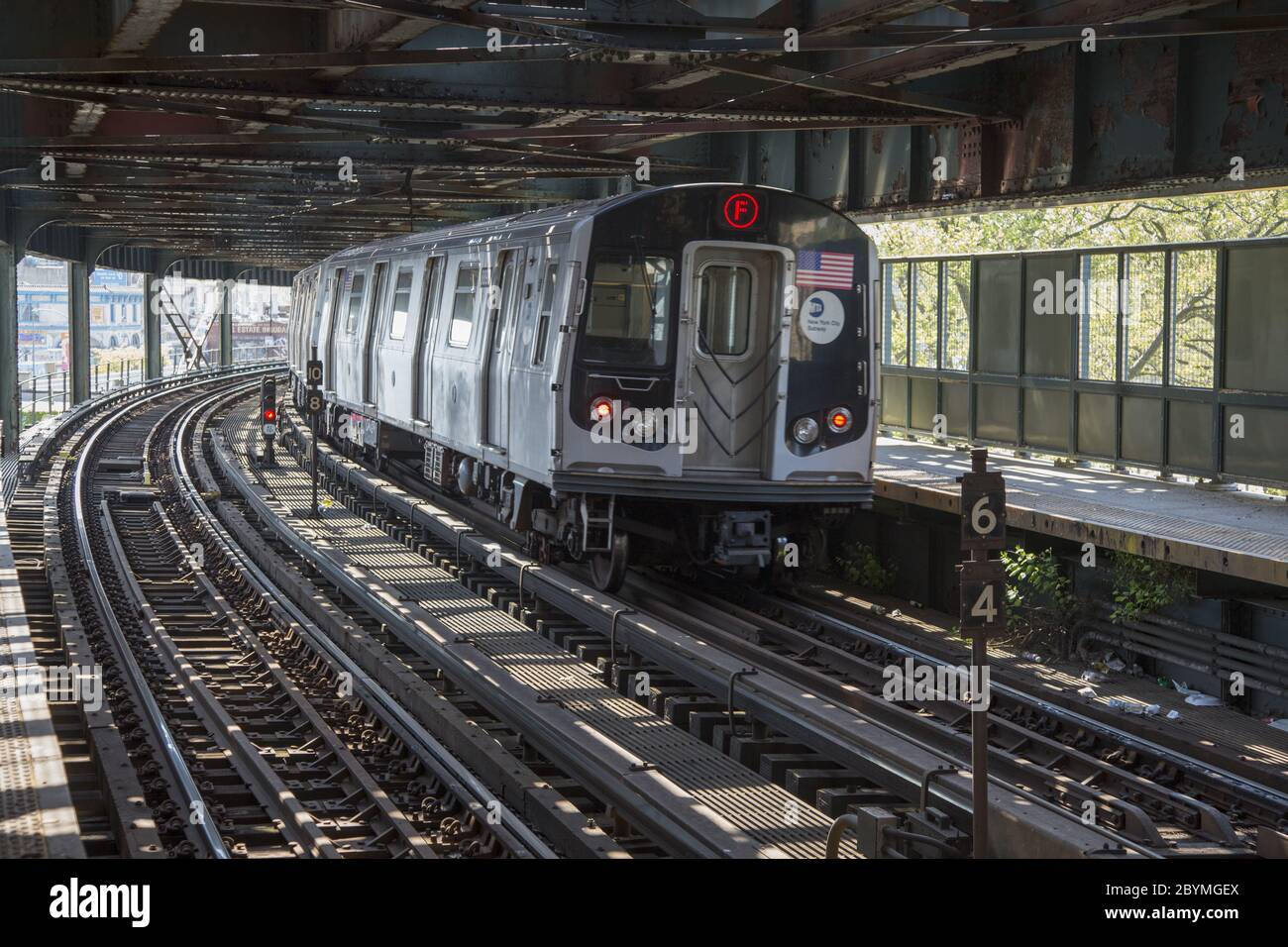 Subway train pulls into the West 8th Street Station by the beach aat ...