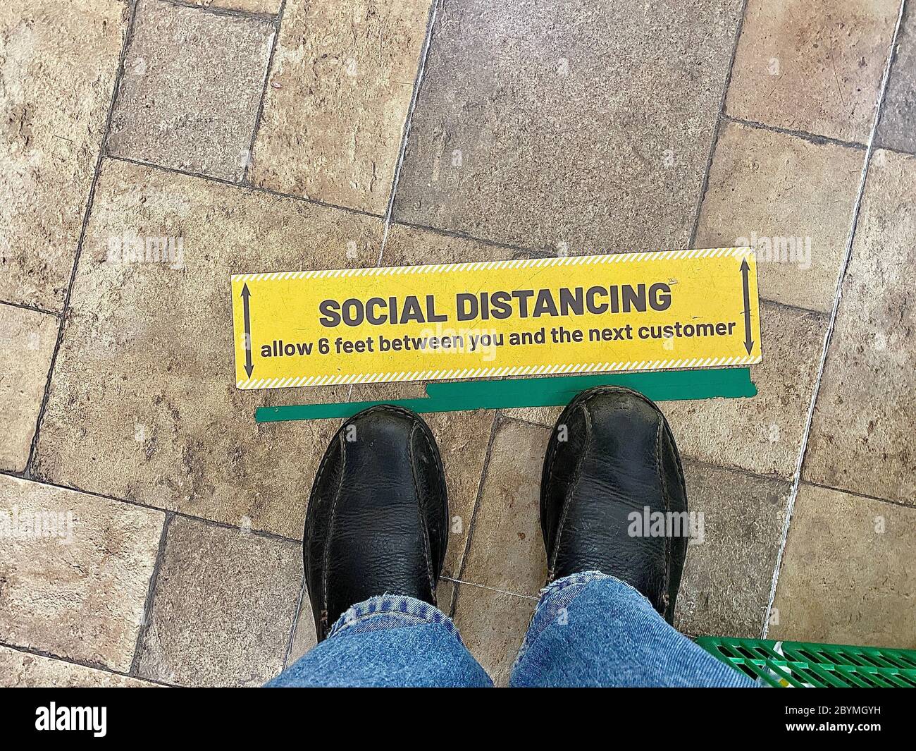 Store social distancing floor marker Stock Photo - Alamy