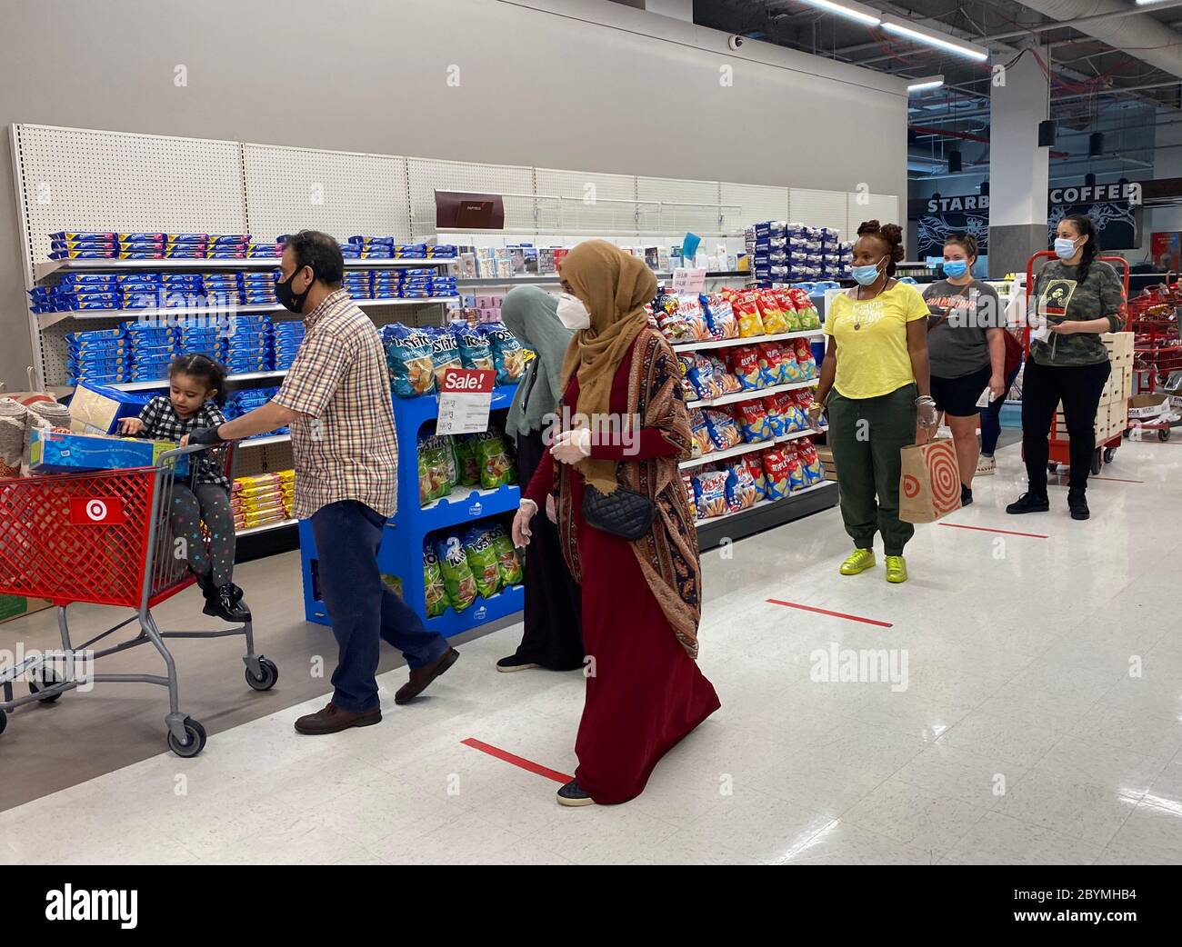 Variety of people shop at a Target store during the Covid-19 pandemic ...