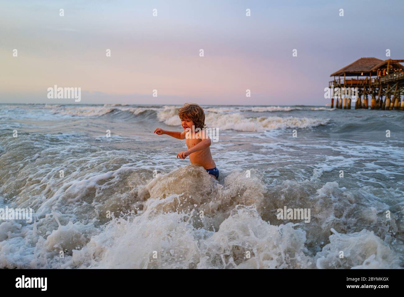 Kids swimming big waves hi-res stock photography and images - Alamy