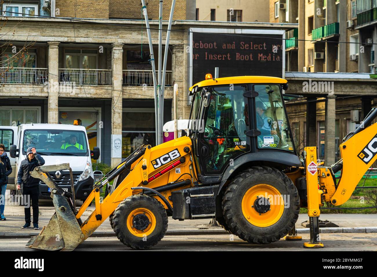 yellow backhoe loader on construction site ready for working in ...
