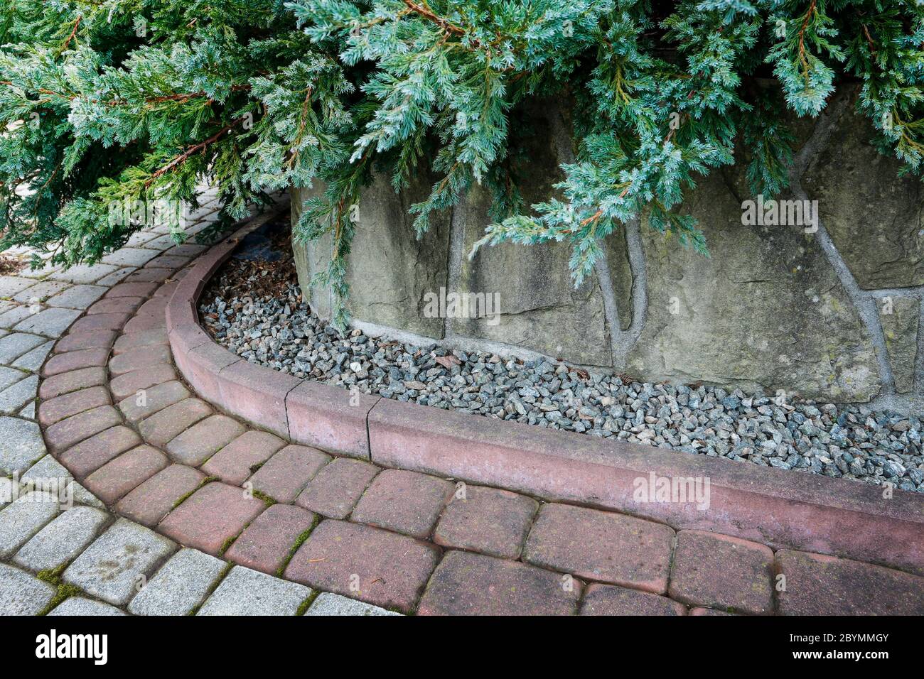 Decorative small pebbles and a paving stones in the garden. Garden ...