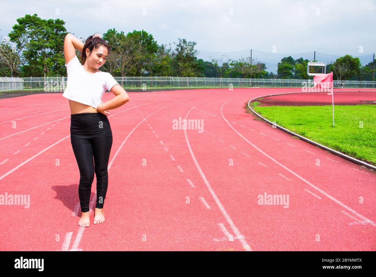 female athlete warm up in stadium arena and race running track ...