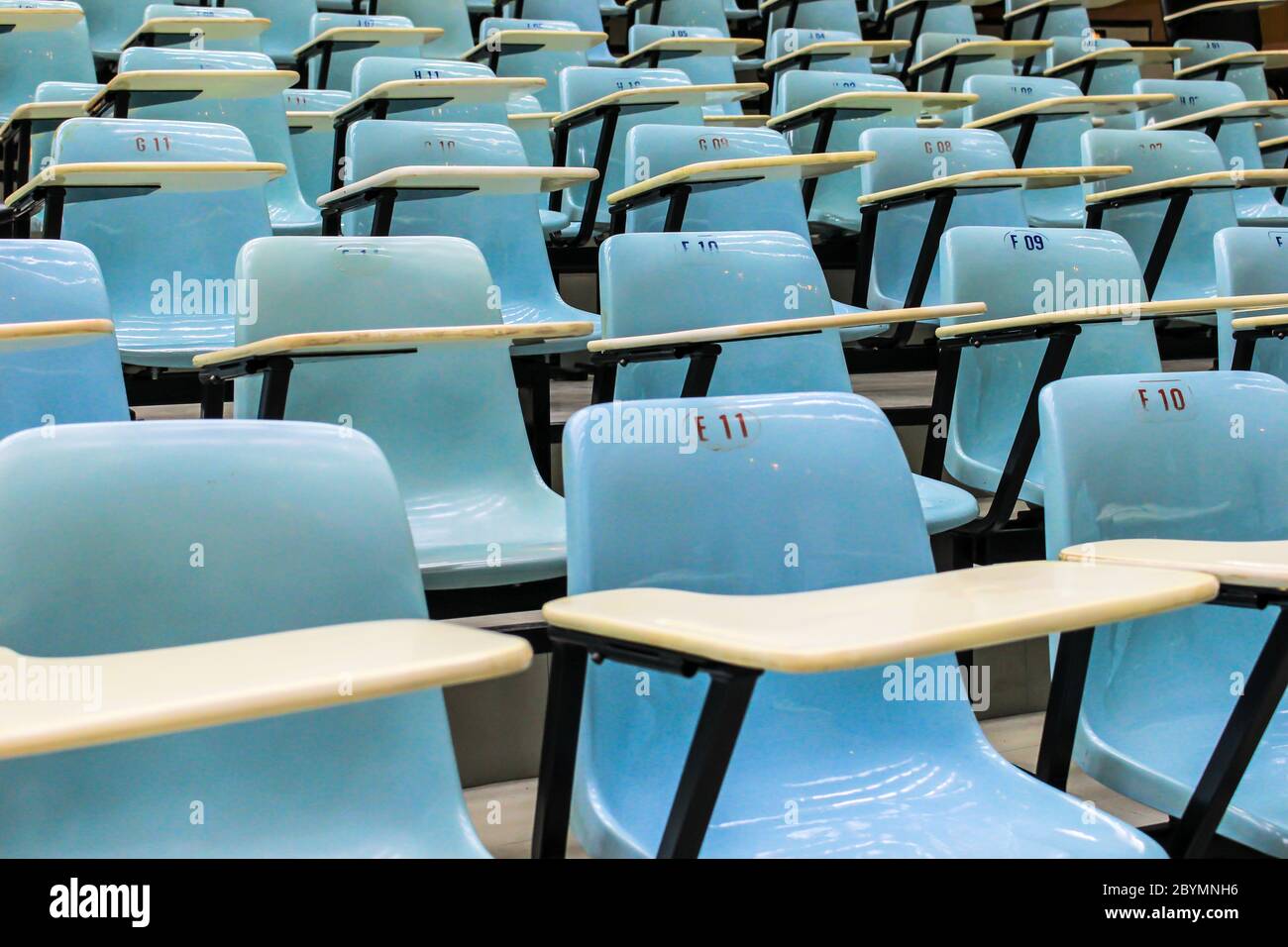 row stack of chairs in lecture room Stock Photo - Alamy