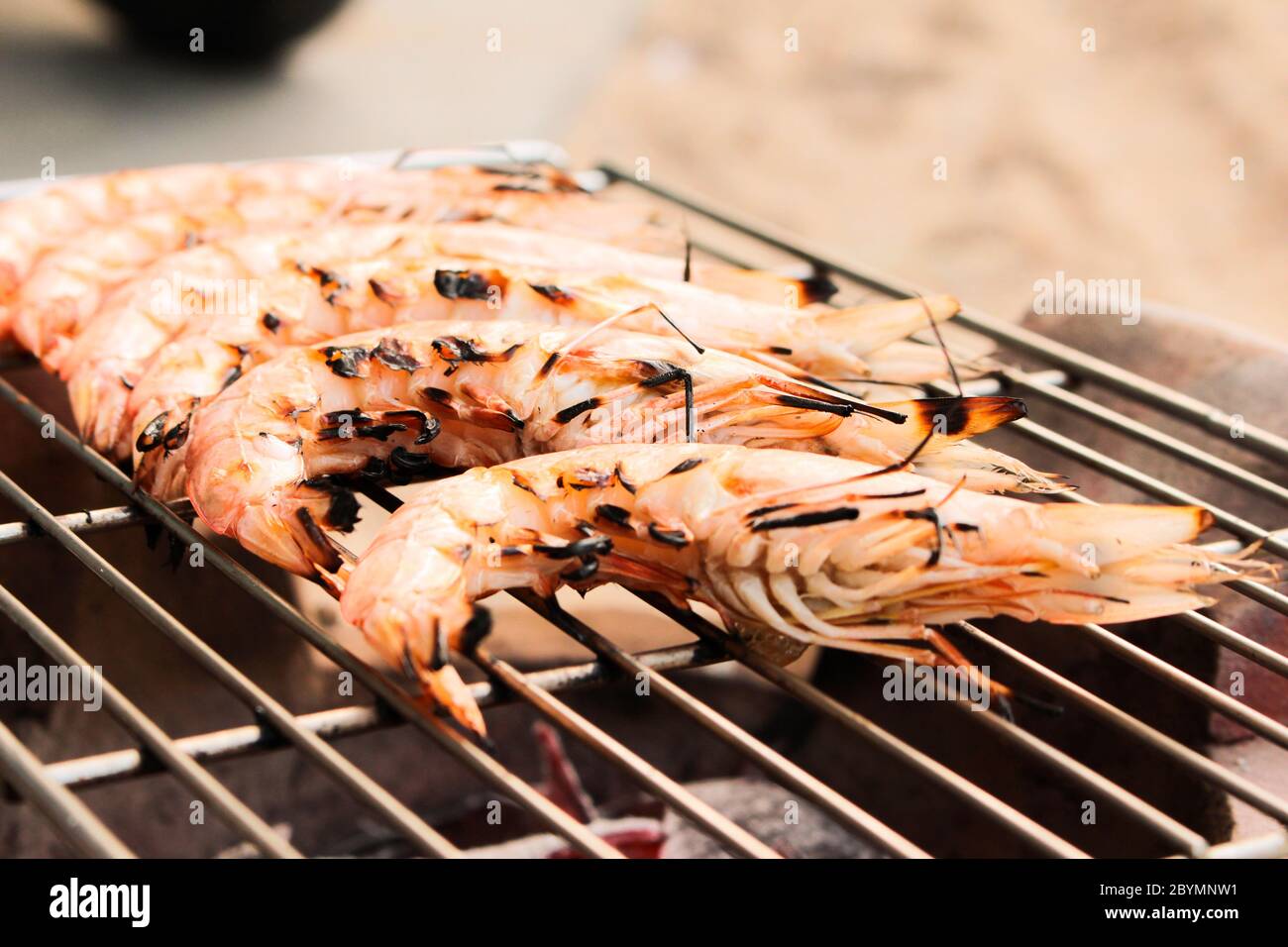 grilled fresh prawns on flaming seafood Stock Photo - Alamy