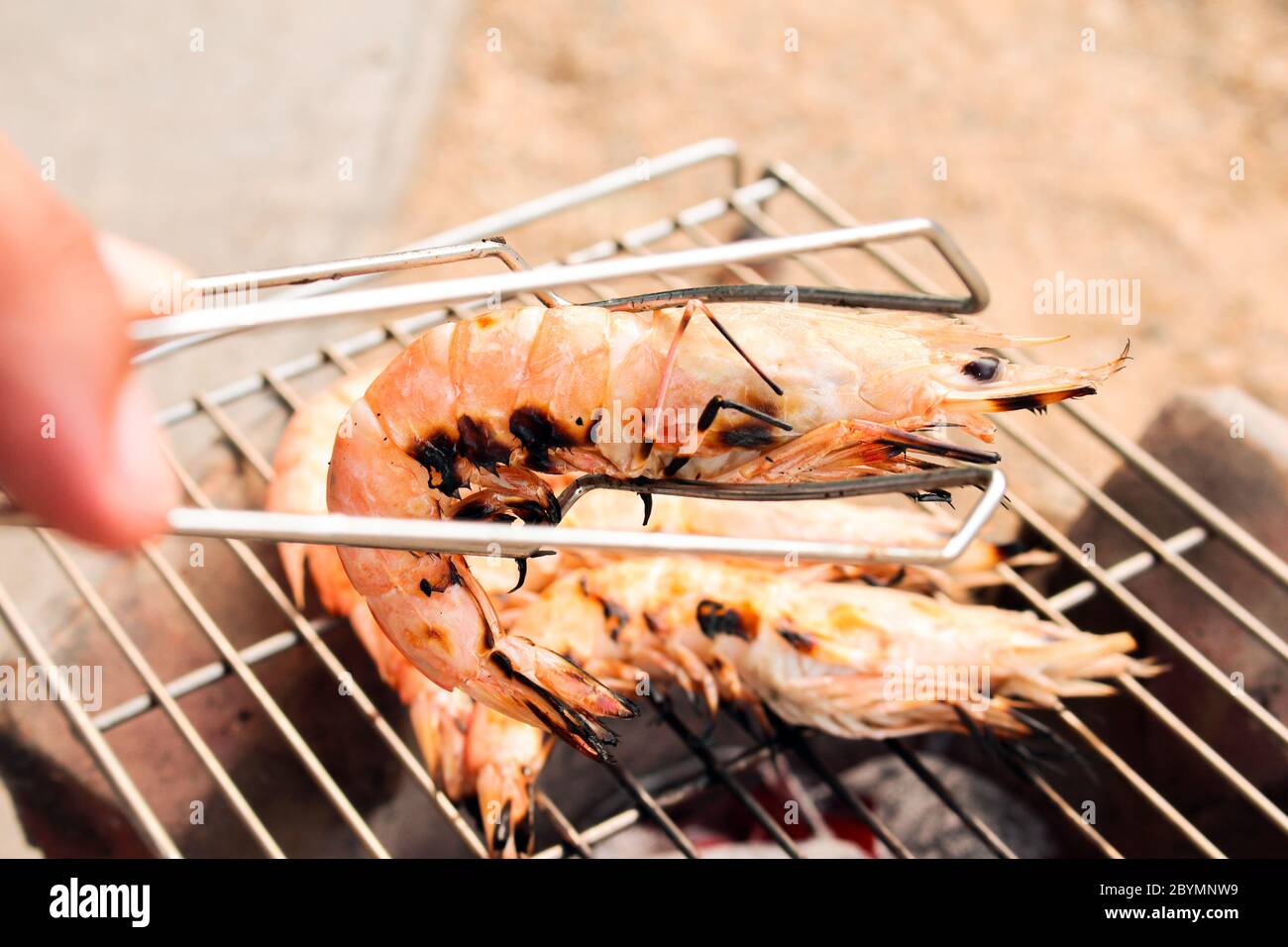 grilled fresh prawns on flaming seafood Stock Photo - Alamy