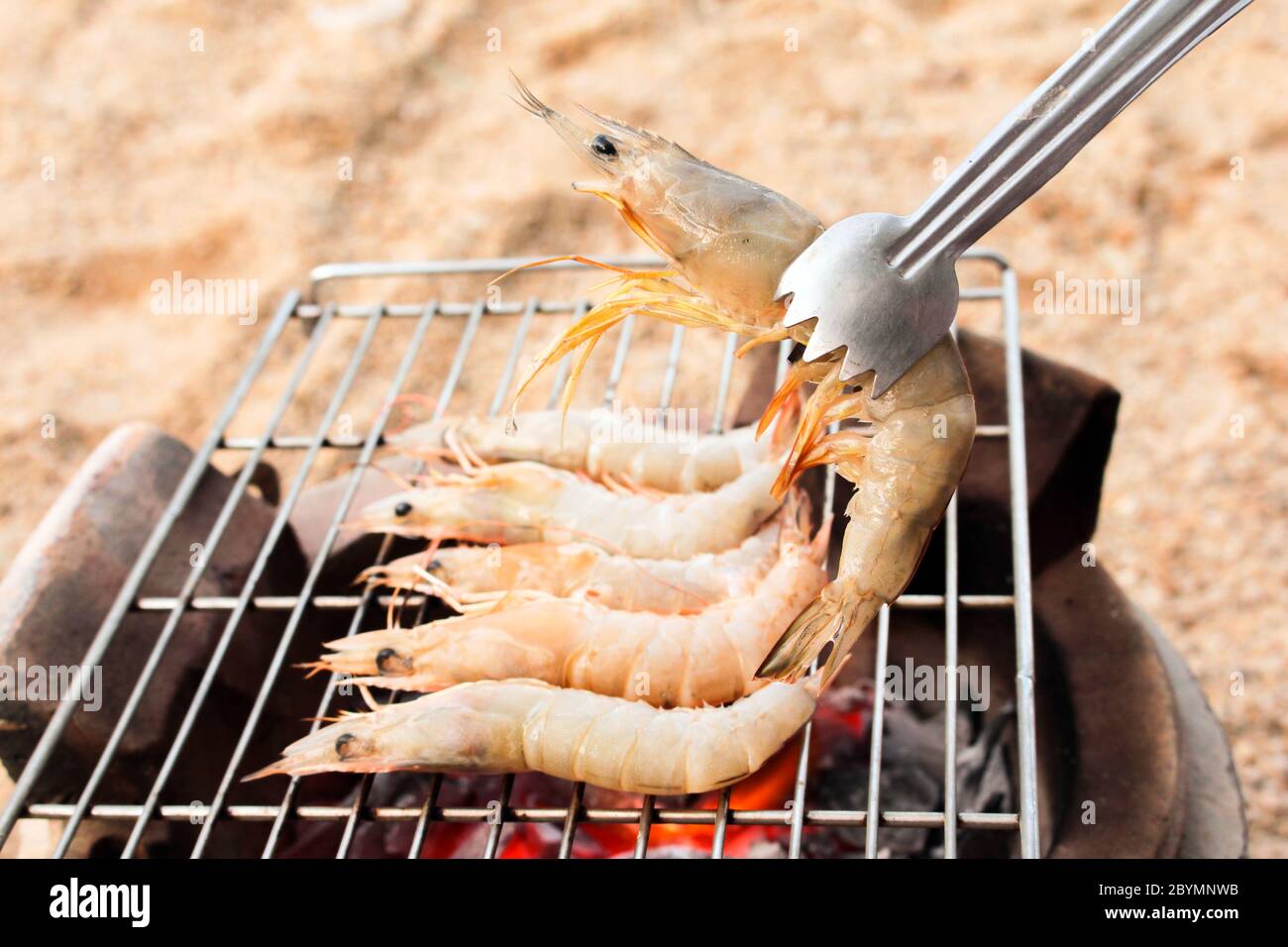 grilled fresh prawns on flaming seafood Stock Photo - Alamy