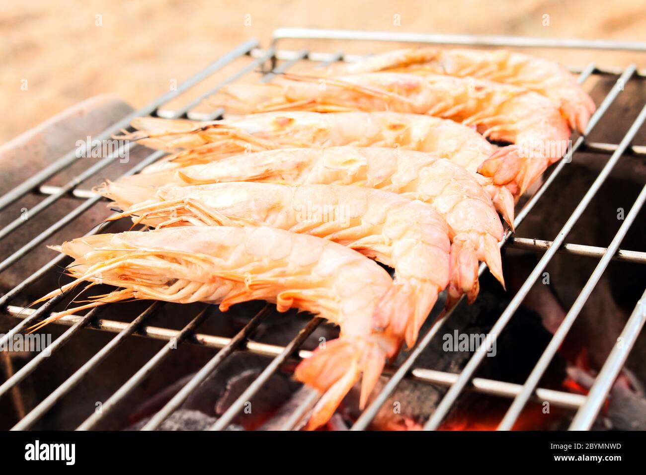 grilled fresh prawns on flaming seafood Stock Photo - Alamy