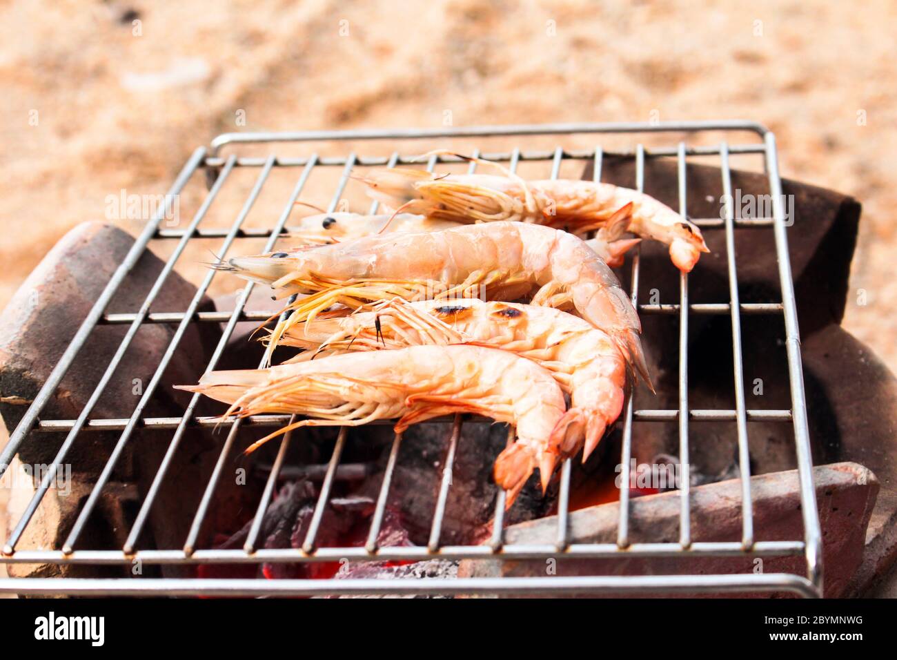 grilled fresh prawns on flaming seafood Stock Photo - Alamy