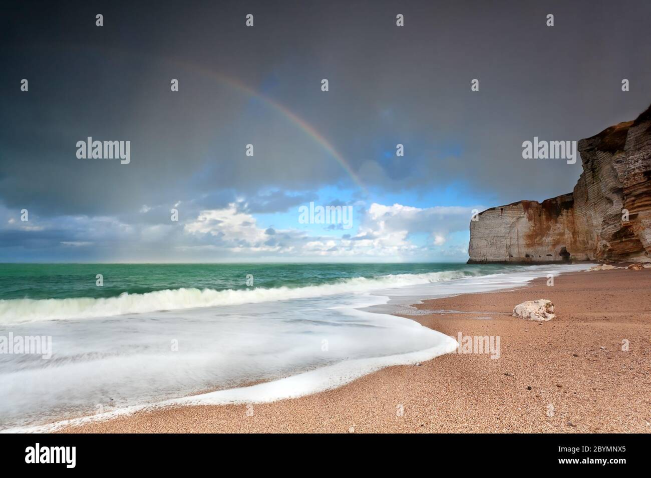rainbow over ocean coast by cliff Stock Photo - Alamy