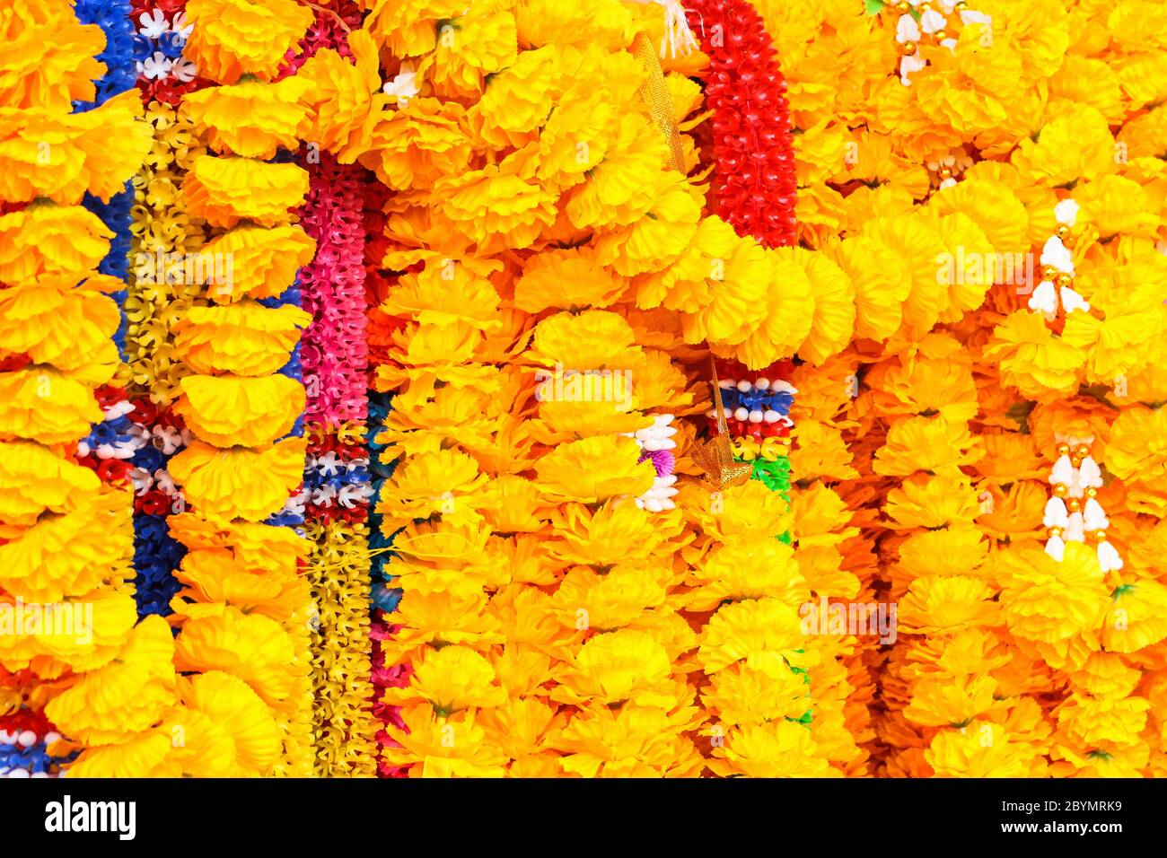 marigold flowers garland texture background Stock Photo - Alamy