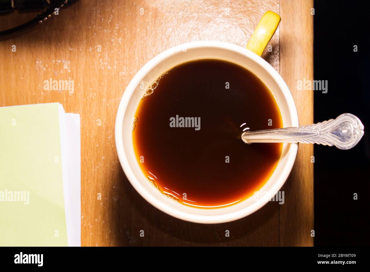 coffee cup at work time on desk wood table background Stock Photo - Alamy