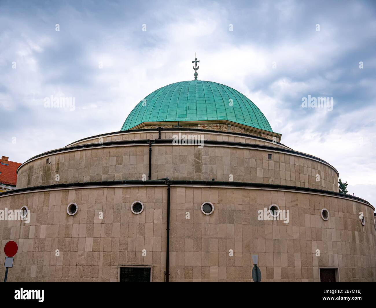 View on a historic mosque in Pecs, Hungary on a cloudy day Stock Photo ...