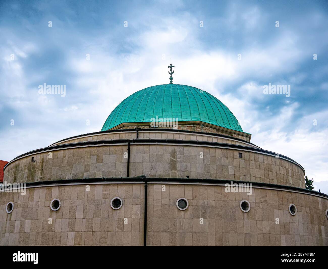 View on a historic mosque in Pecs, Hungary on a cloudy day Stock Photo ...