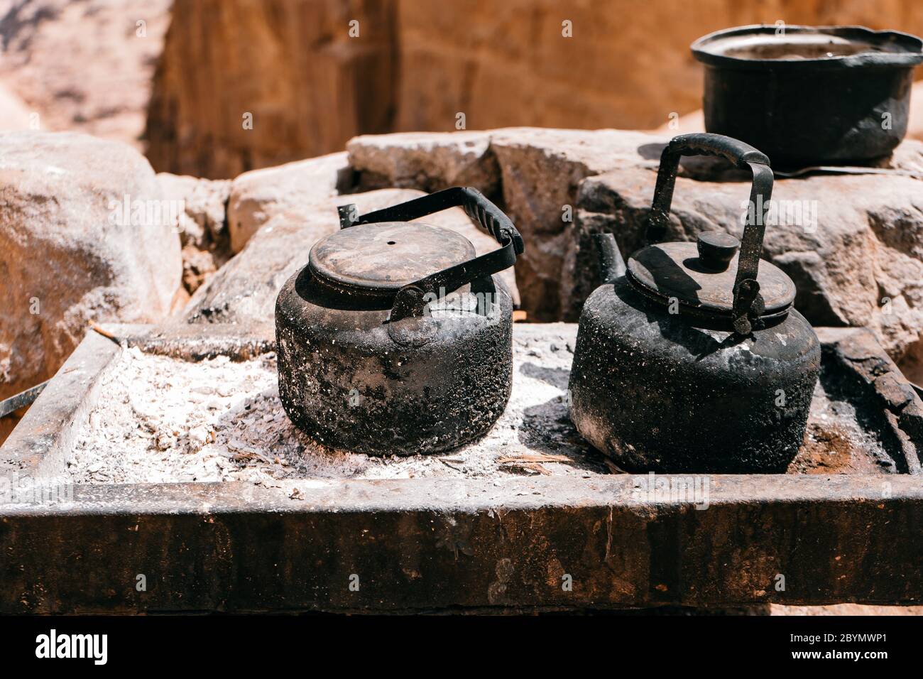 Bedouin tea being prepared by the fire. Cooking coffee on the fire ...