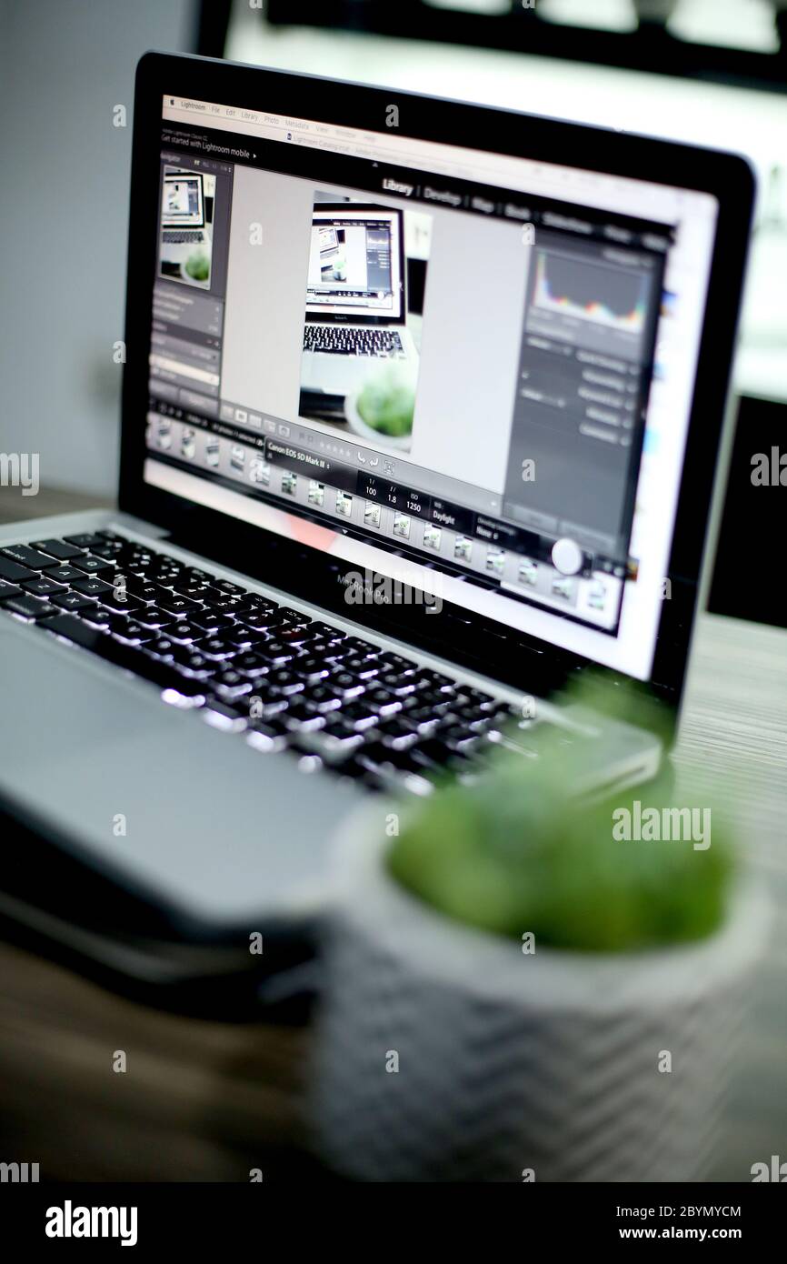 working with computer laptop, working with photo editing software Stock ...