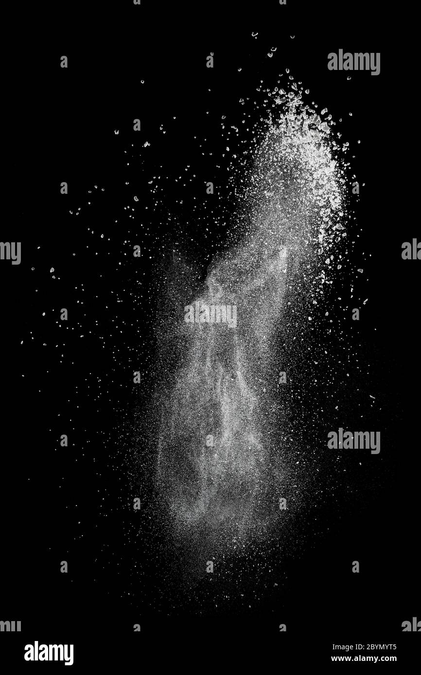 White powder explosion isolated on black Stock Photo - Alamy