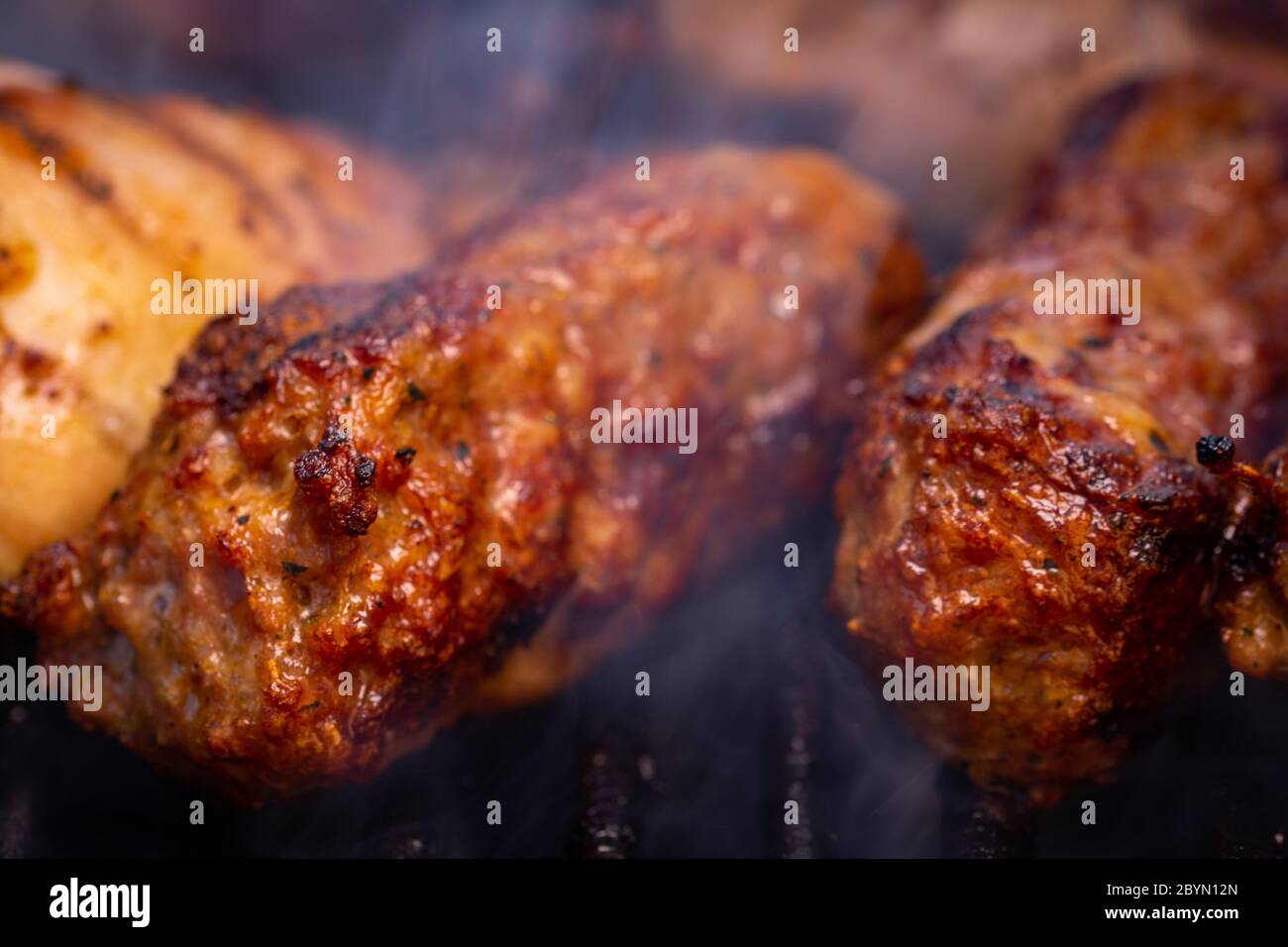 Traditional Romanian food Meat Balls "mici" on grill. Tasty meat balls ...