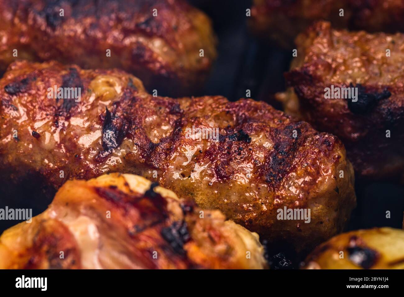 Traditional Romanian food Meat Balls "mici" on grill. Tasty meat balls ...
