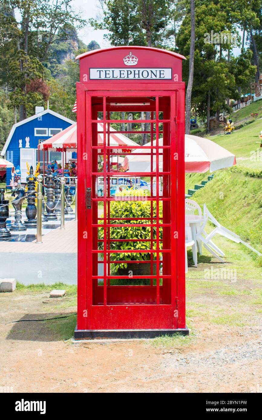 red telephone box in garden of 7 heaven krabi thailand Stock Photo - Alamy