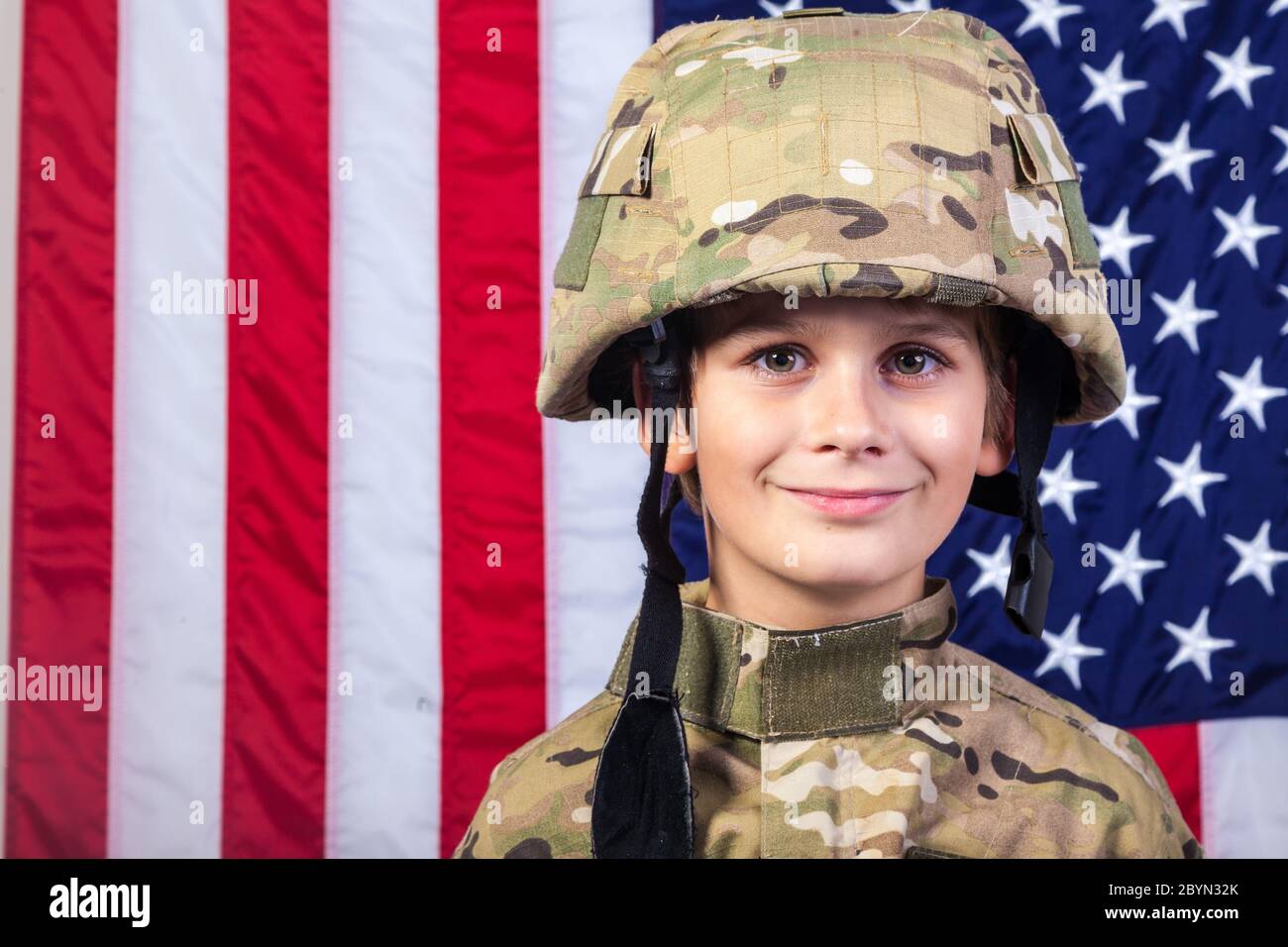 Young boy dressed like a soldier with American flag Stock Photo - Alamy
